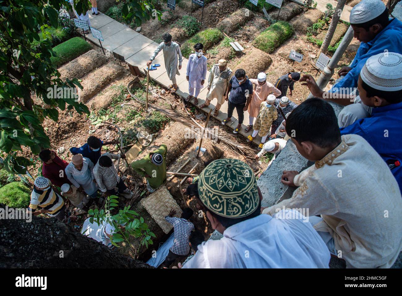 Kids observe a burial at the Azimpur Cemetery, one of the largest in ...