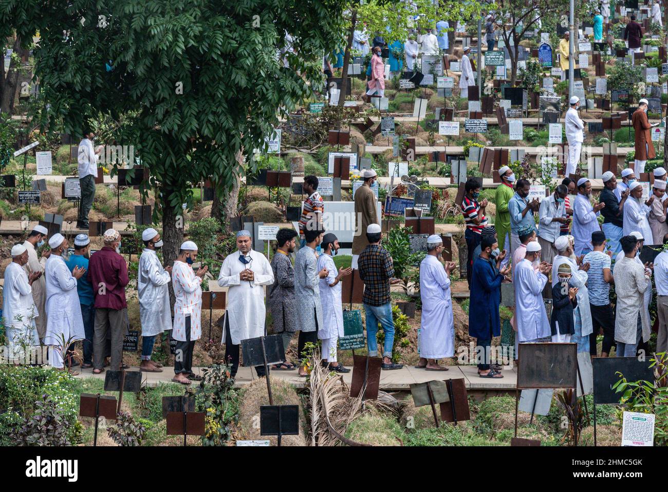 Crowd of Muslims seen a the cemetery during Ramadan celebrations some attending burials, others ...