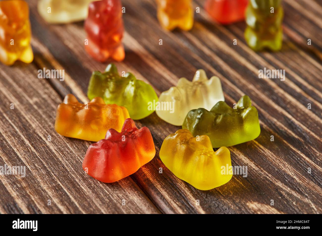 Multicolored bears gummy candy on wooden vintage background. Jelly ...