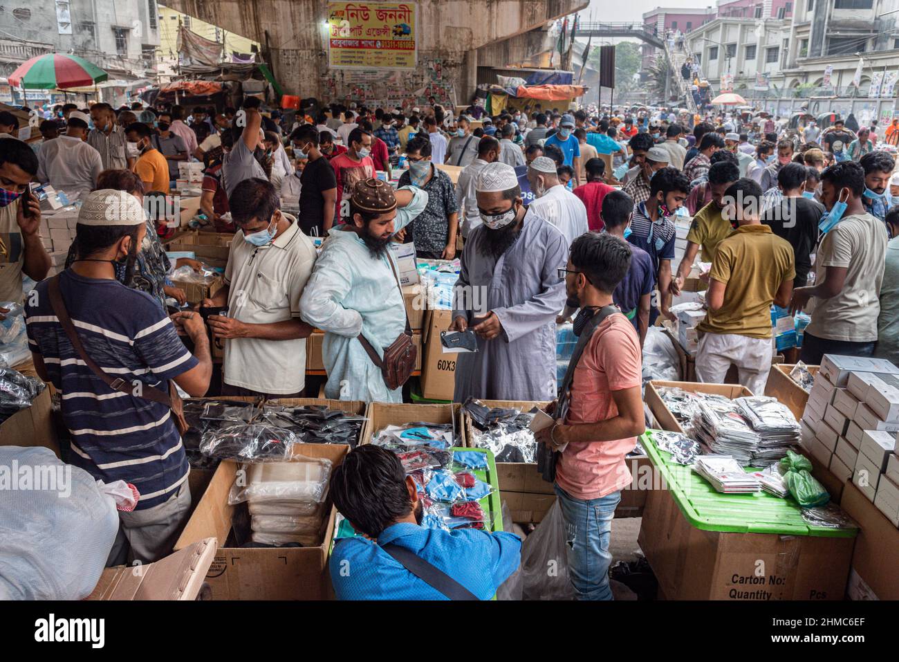People buying face masks at a market on the streets of Dhaka. (Photo by ...