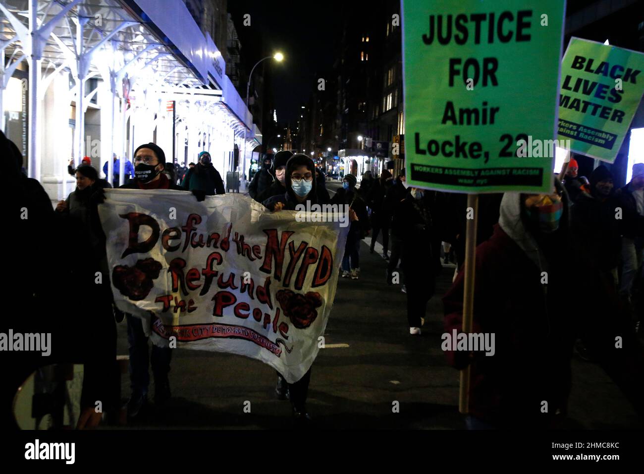 Demonstrators march with signs through the streets days after Amir ...