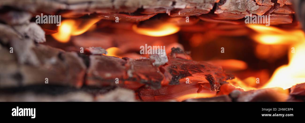 Fire is burning among wood closeup background Stock Photo - Alamy