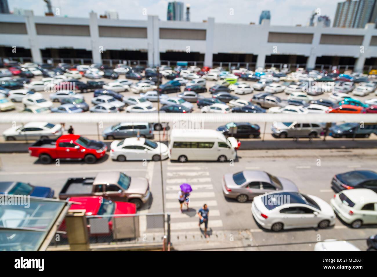 Blur of car at public car parking background Stock Photo - Alamy