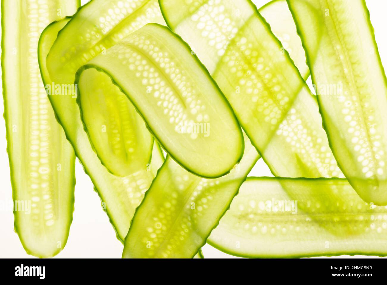 Beautiful fresh transparent cucumber slices on white background Stock ...