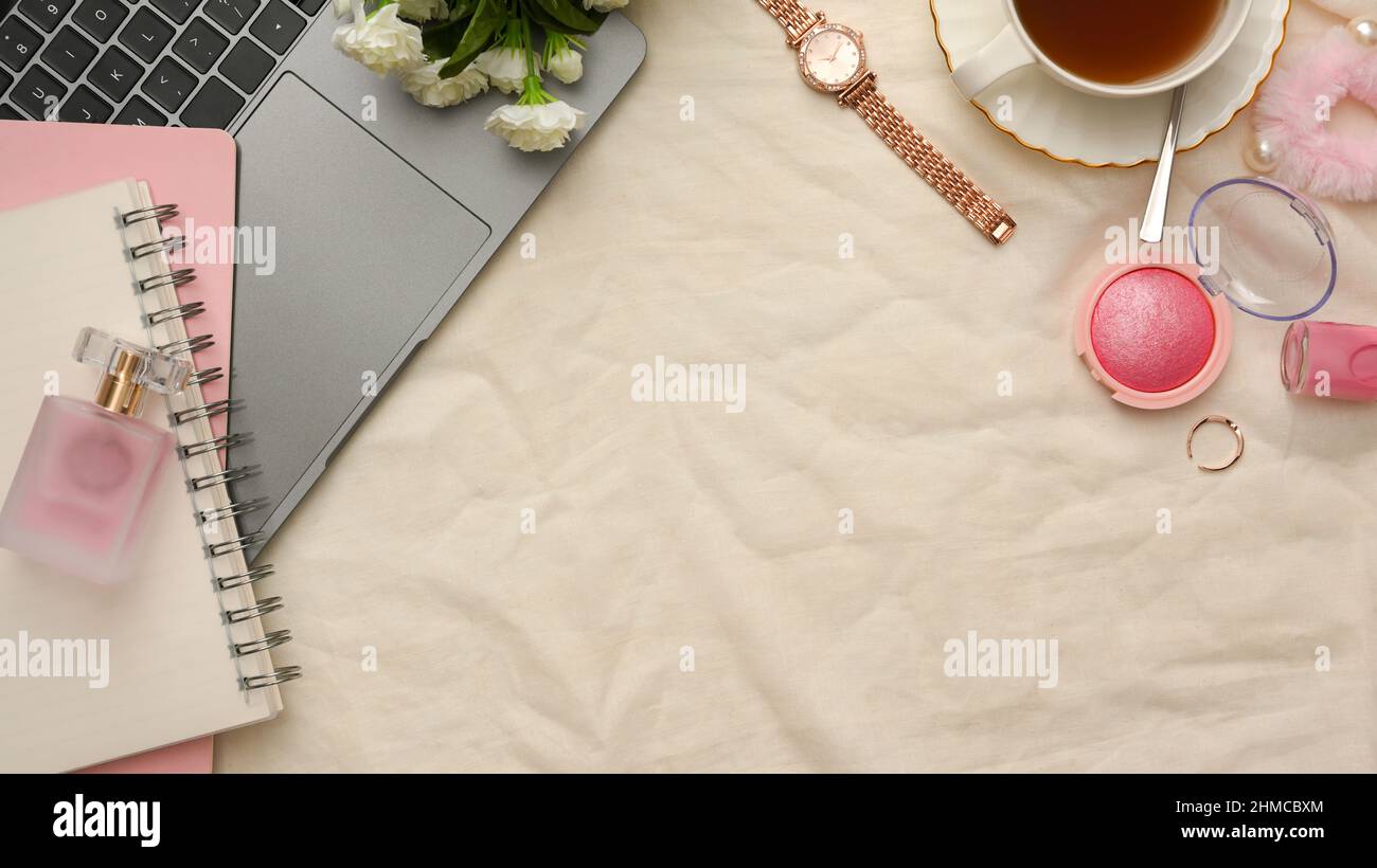 Top view, Flat lay, A stylish pink female office desk with laptop ...