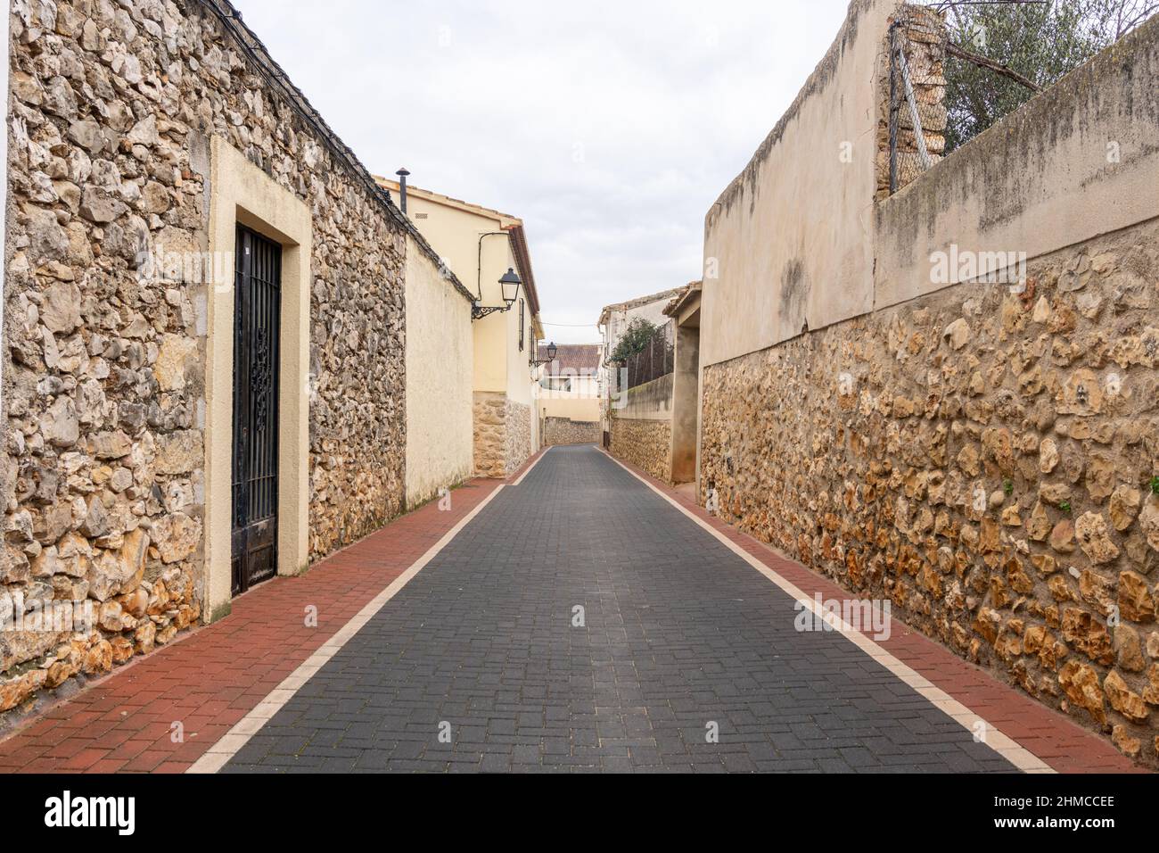 Beautiful old path going through the historical houses Stock Photo - Alamy