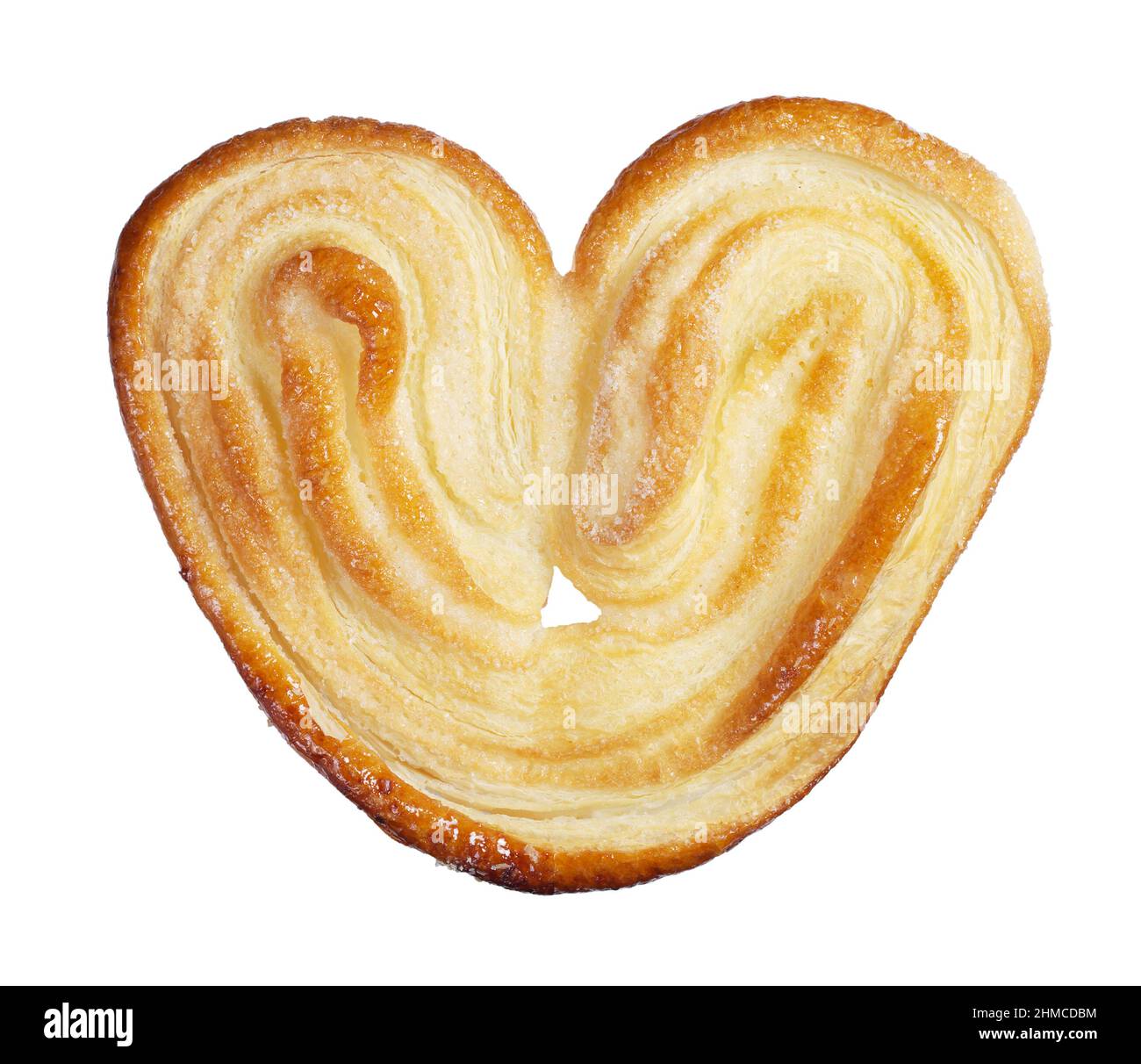 Puff pastry cookie in the shape of a heart isolated on a white ...