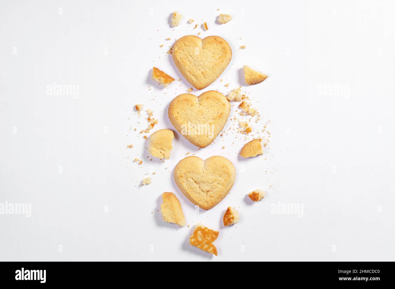 Shortbread cookies in shape of heart whole end broken on white ...