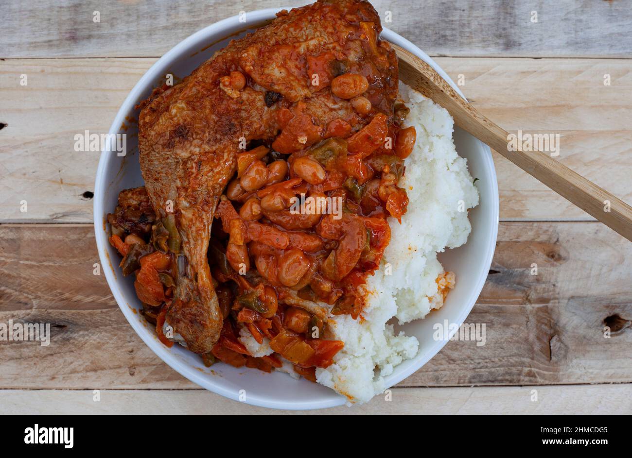 Traditional south African pap and roasted chicken, maize meal with ...