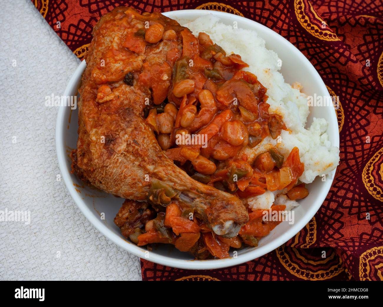 Traditional south African pap and roasted chicken, maize meal with ...