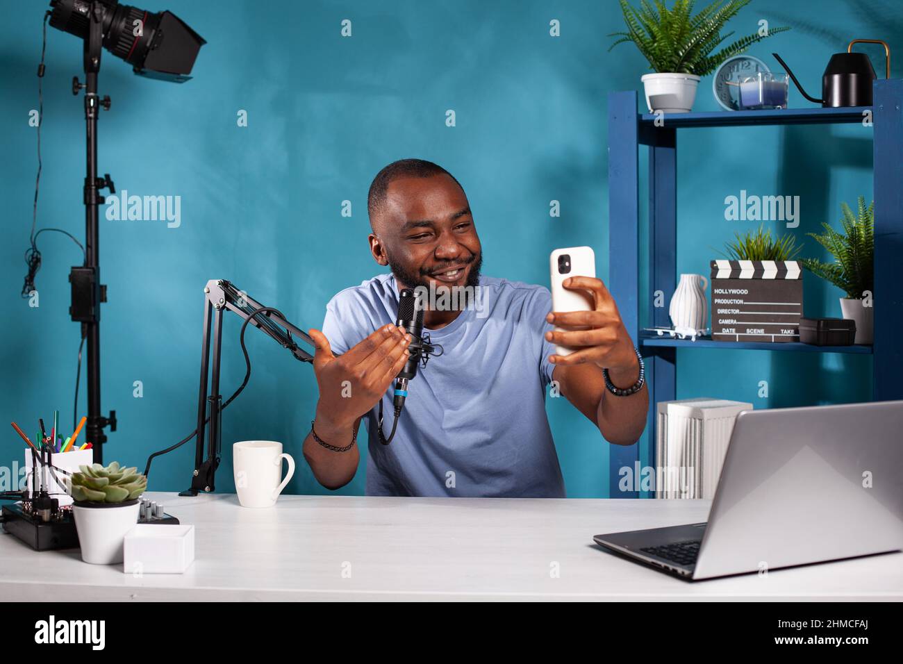 African american vlogger interacting with fans in live video call on ...