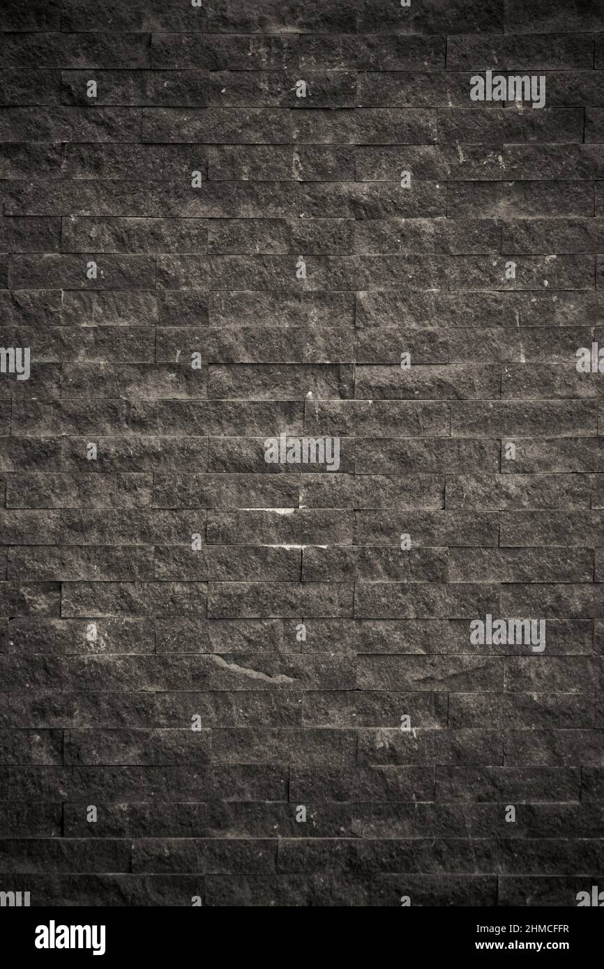 Black stone wall texture background Stock Photo - Alamy