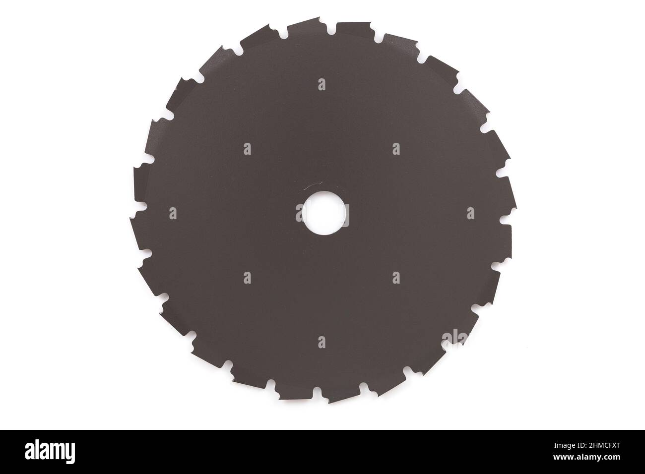 round metal serrated cutting disc for lawn mower trimmer on a white ...