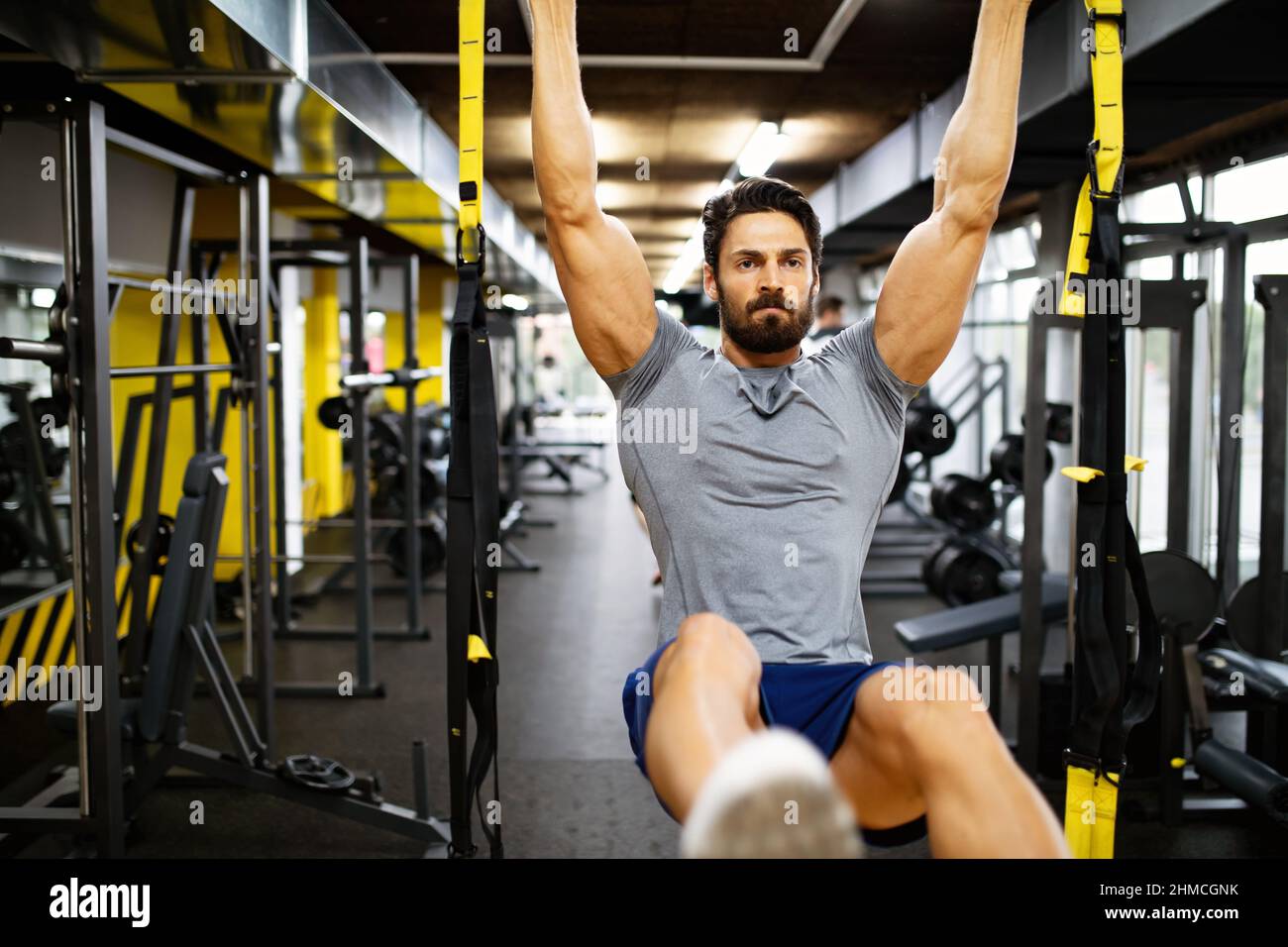 Portrait of fit man working out in gym. Sport people healthy lifestyle ...