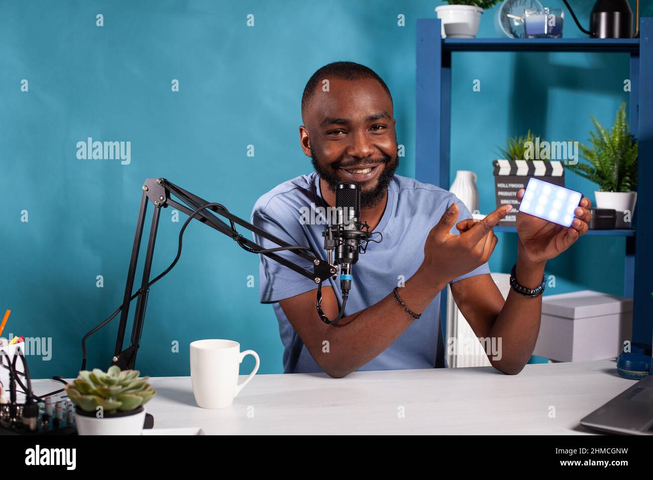 Vlogger using index finger to point out key benefits of using portable ...