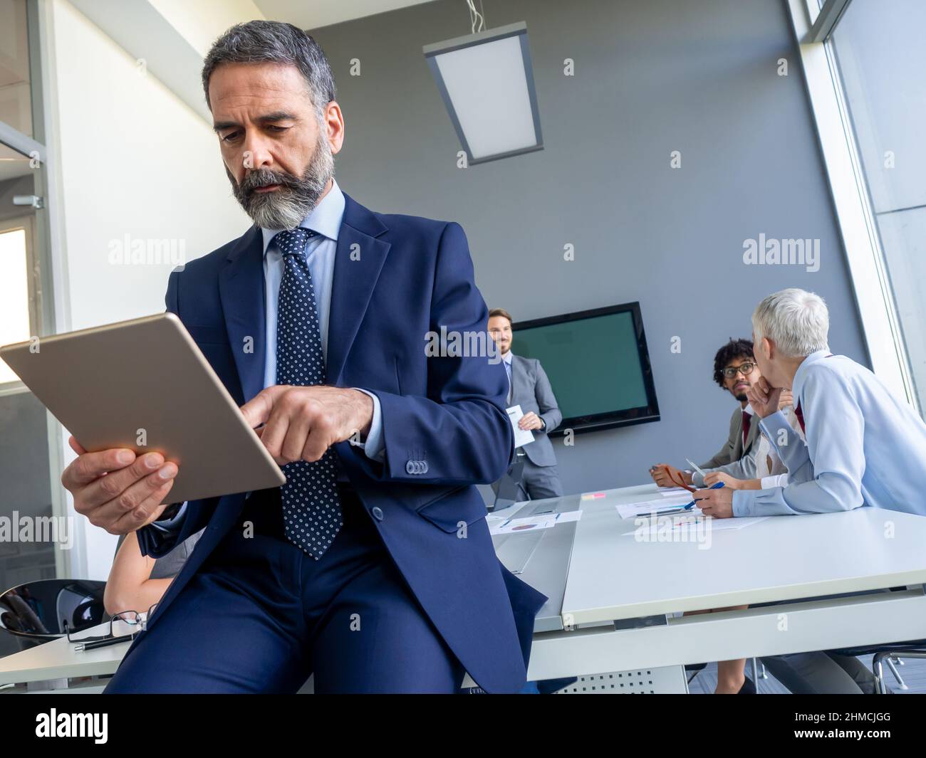 Corporate business team and manager in a meeting Stock Photo - Alamy