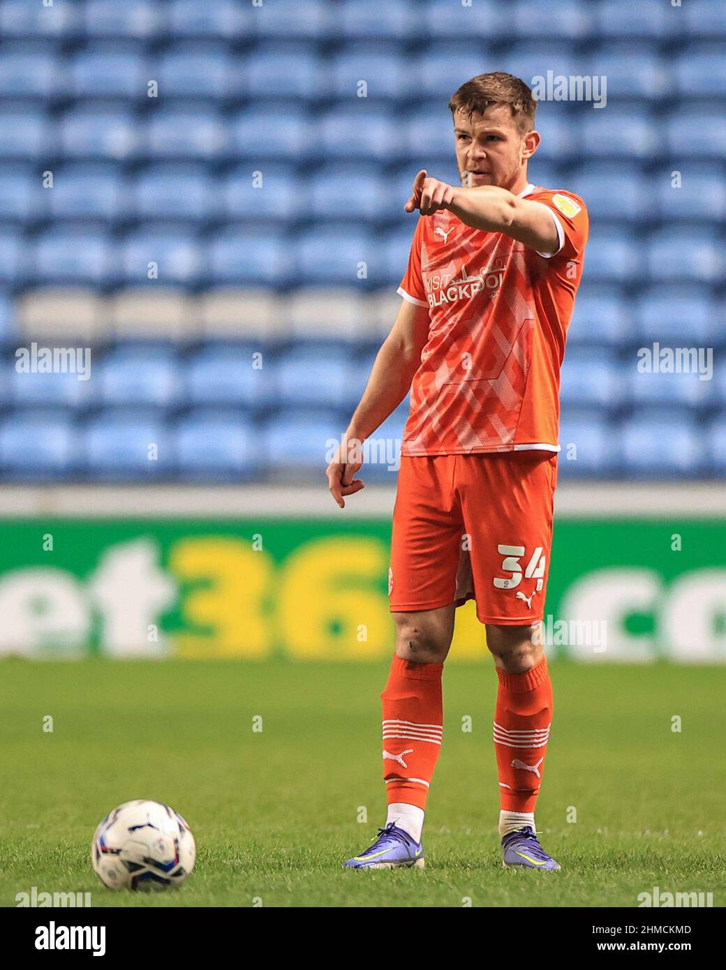 Jordan Thorniley #34 of Blackpool gives his team instructions Stock ...