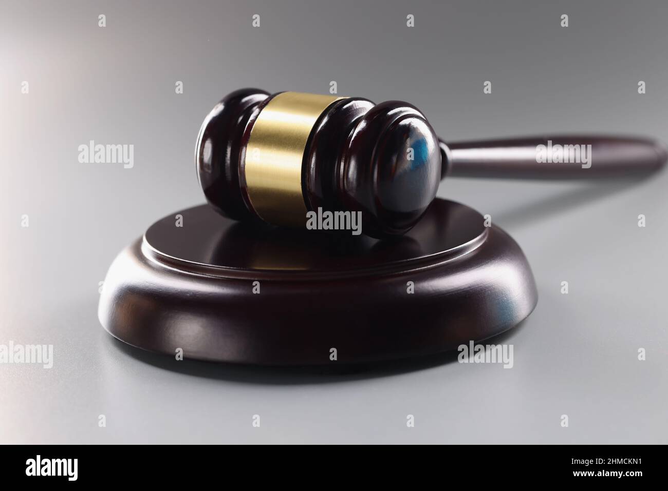 Judge black wooden hammer on soundboard on grey background, attorney ...
