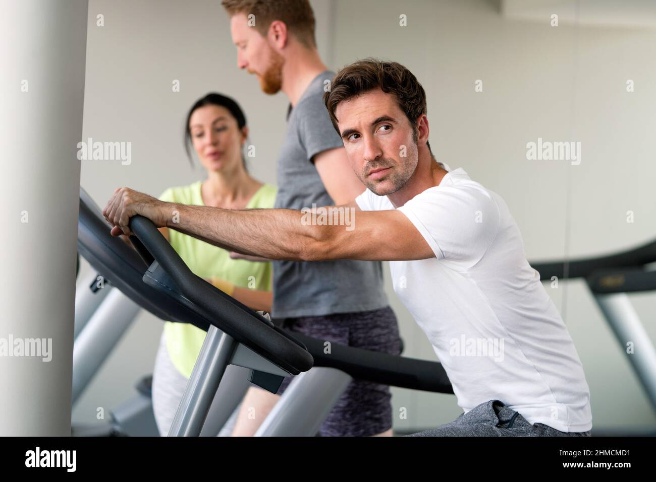 Fit people working out at the gym Stock Photo - Alamy