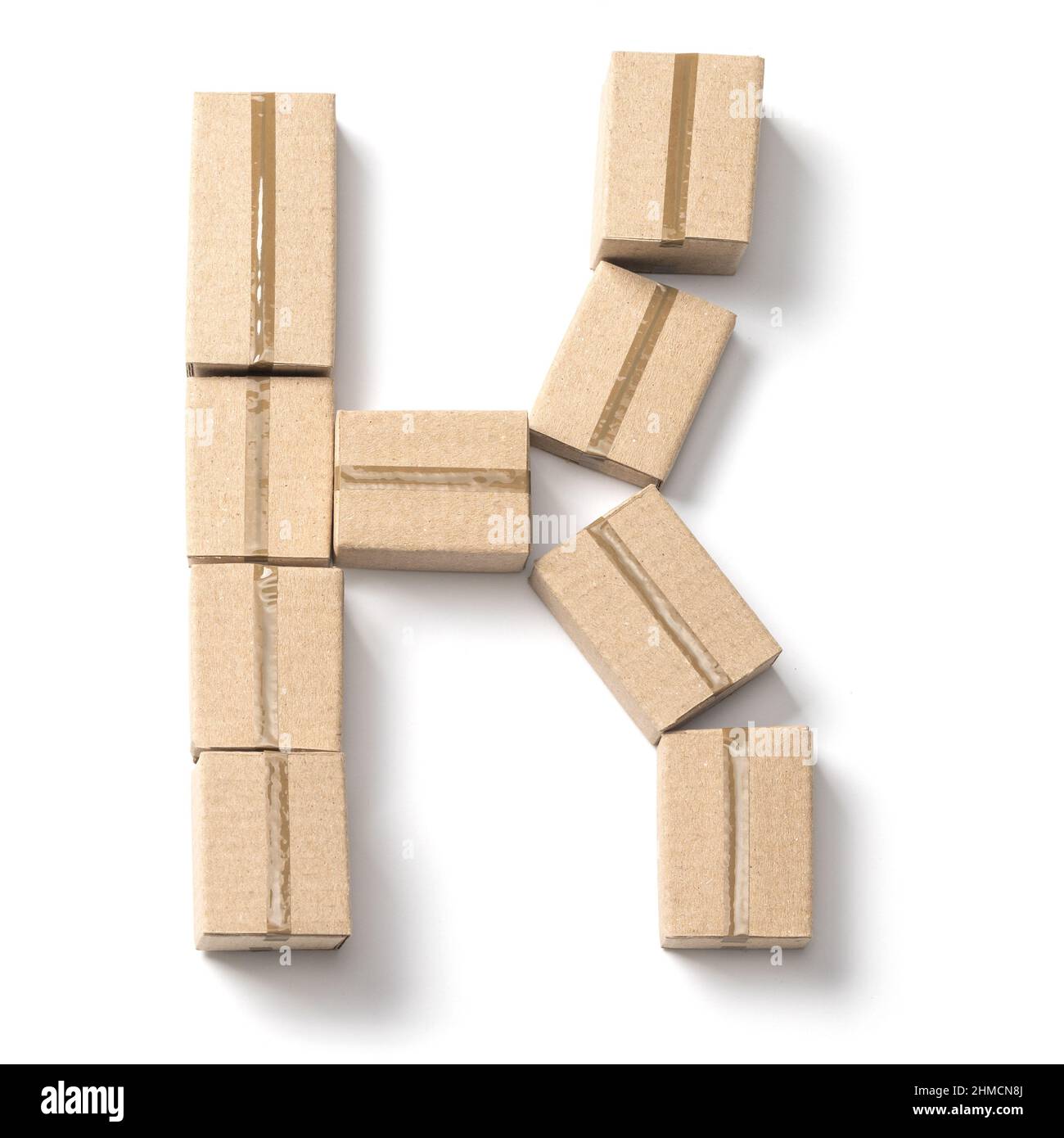 Letter K. Alphabet from cardboard boxes for delivery isolated on white ...