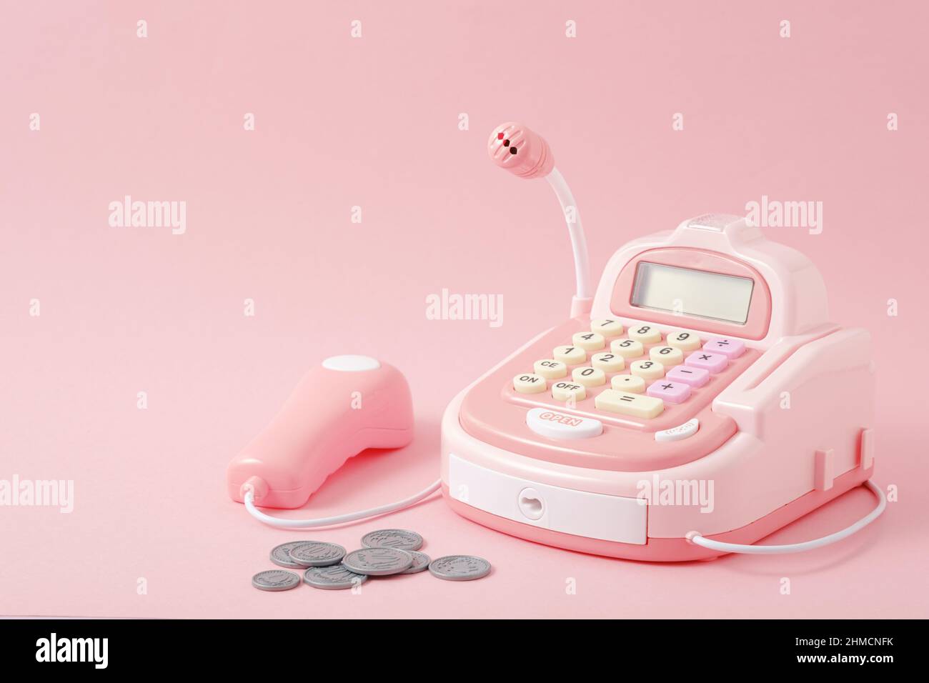 closeup pink toy cash register on pink background, play store Stock ...