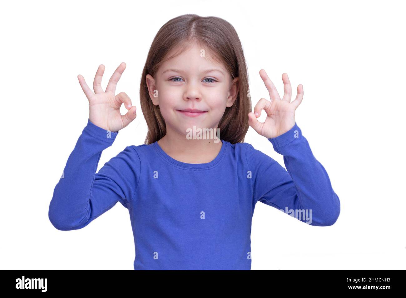 Smiling child kid showing gesture OK by fingers on two hands isolated ...