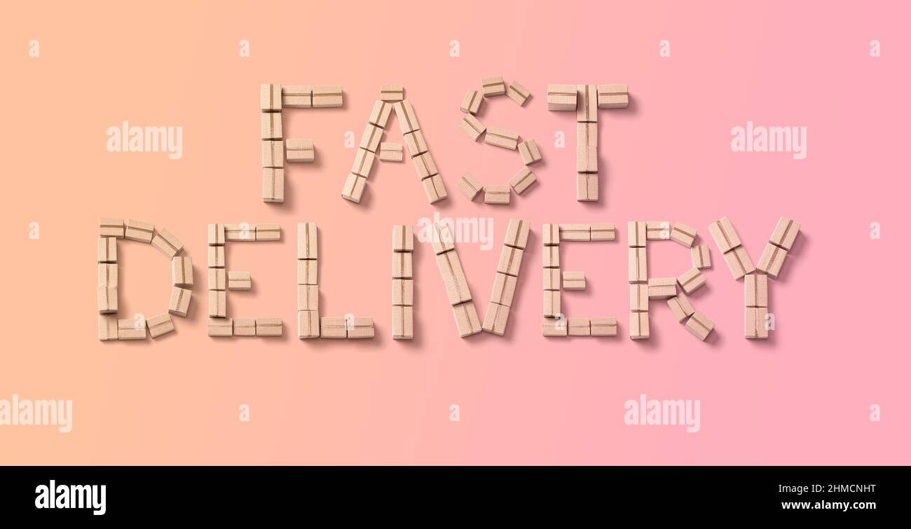 Fast delivery from cardboard boxes on a pink background Stock Photo - Alamy