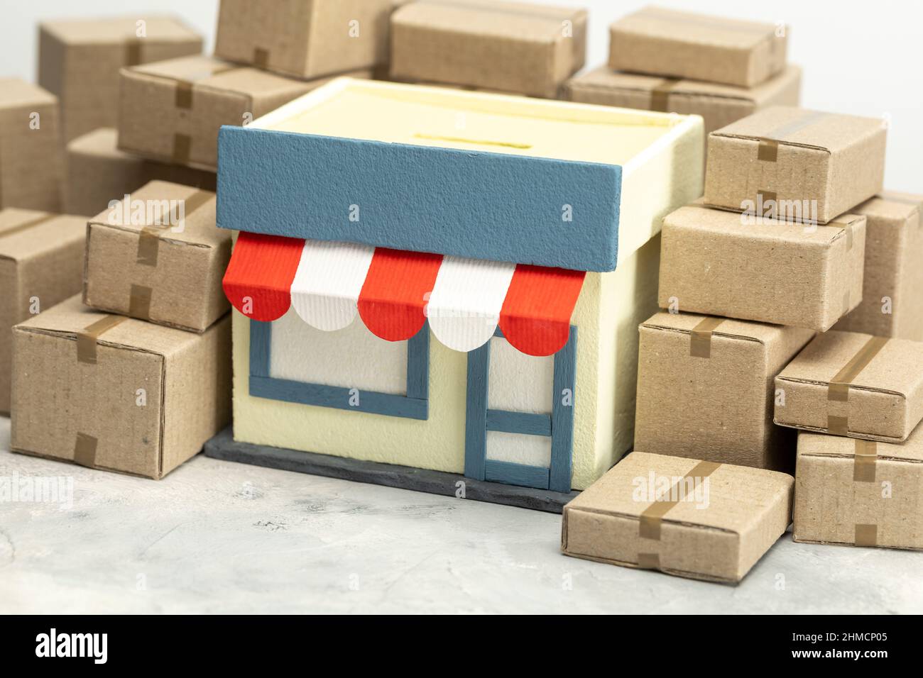 Order delivery. Shop and lots of cardboard boxes Stock Photo - Alamy
