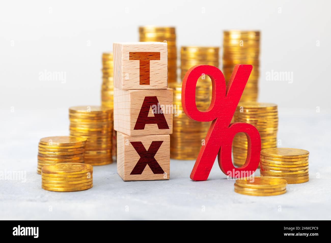 Tax percentage. Gold stack of coins and percent sign Stock Photo - Alamy