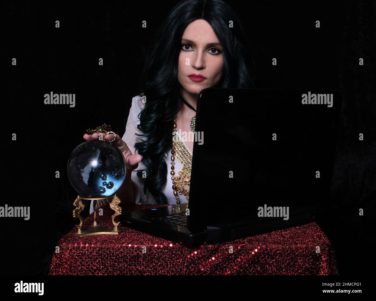 Psychic Tarot Card Reader with Crystal Ball using Laptop Computer Stock ...