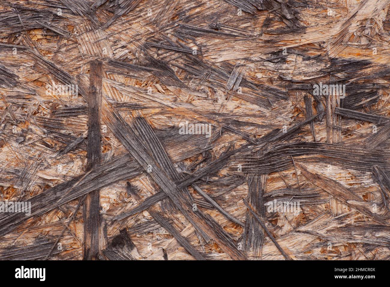 Background image with burnt wooden shavings and sawdust or OSB Panel ...