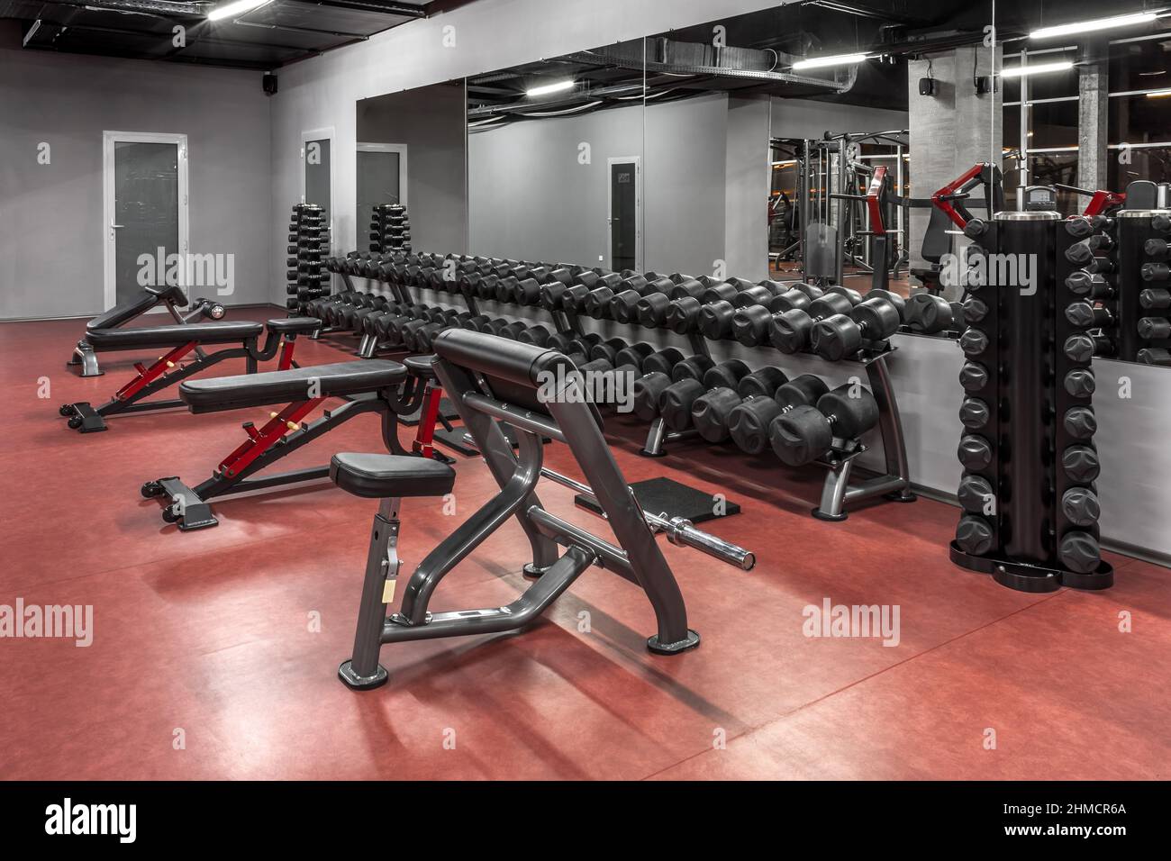 Interior of spacious empty gym with special equipment for physical ...