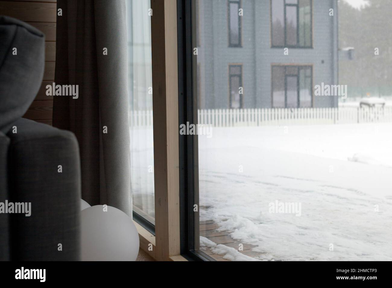 interior of a modern room and snowfall started outside Stock Photo - Alamy