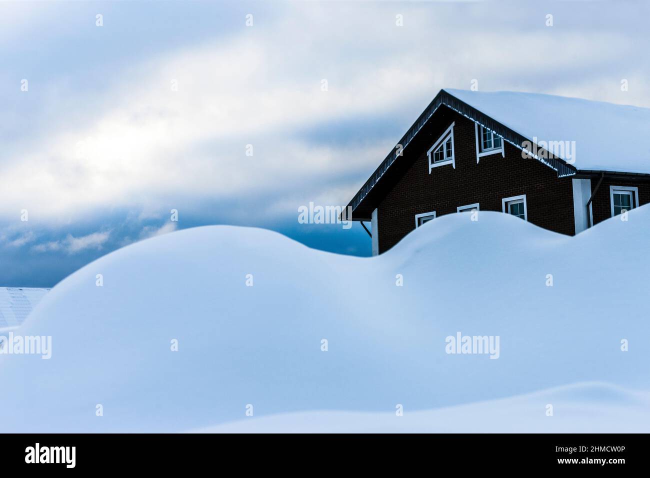 a rooftop of a house after a snowstorm, winter scene Stock Photo - Alamy
