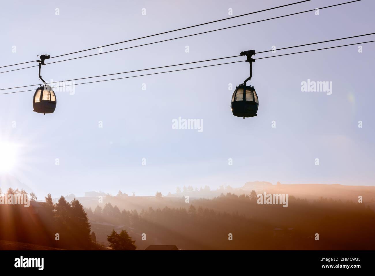 Silhouette two air cable cabins hi-res stock photography and images - Alamy