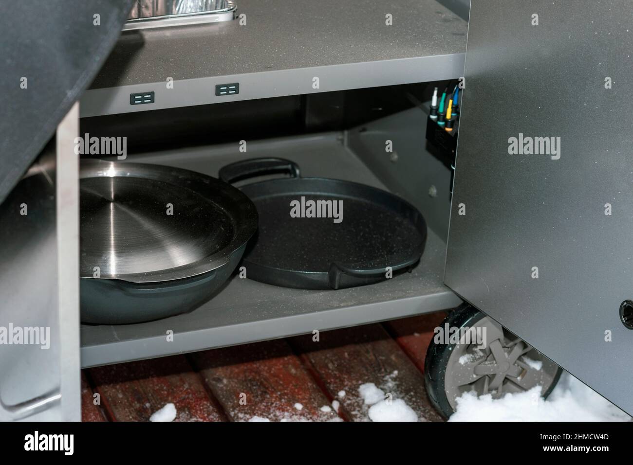 collection of kitchenware inside a portable cooker, winter scene Stock ...
