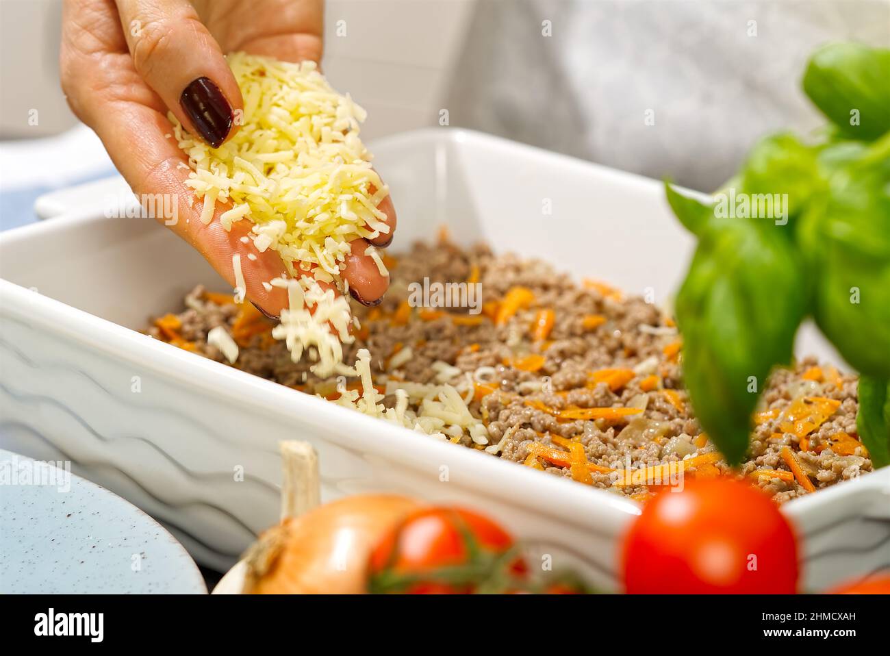 Woman preparing meat lasagna in kitchen. lasagna recipe - Italian food ...