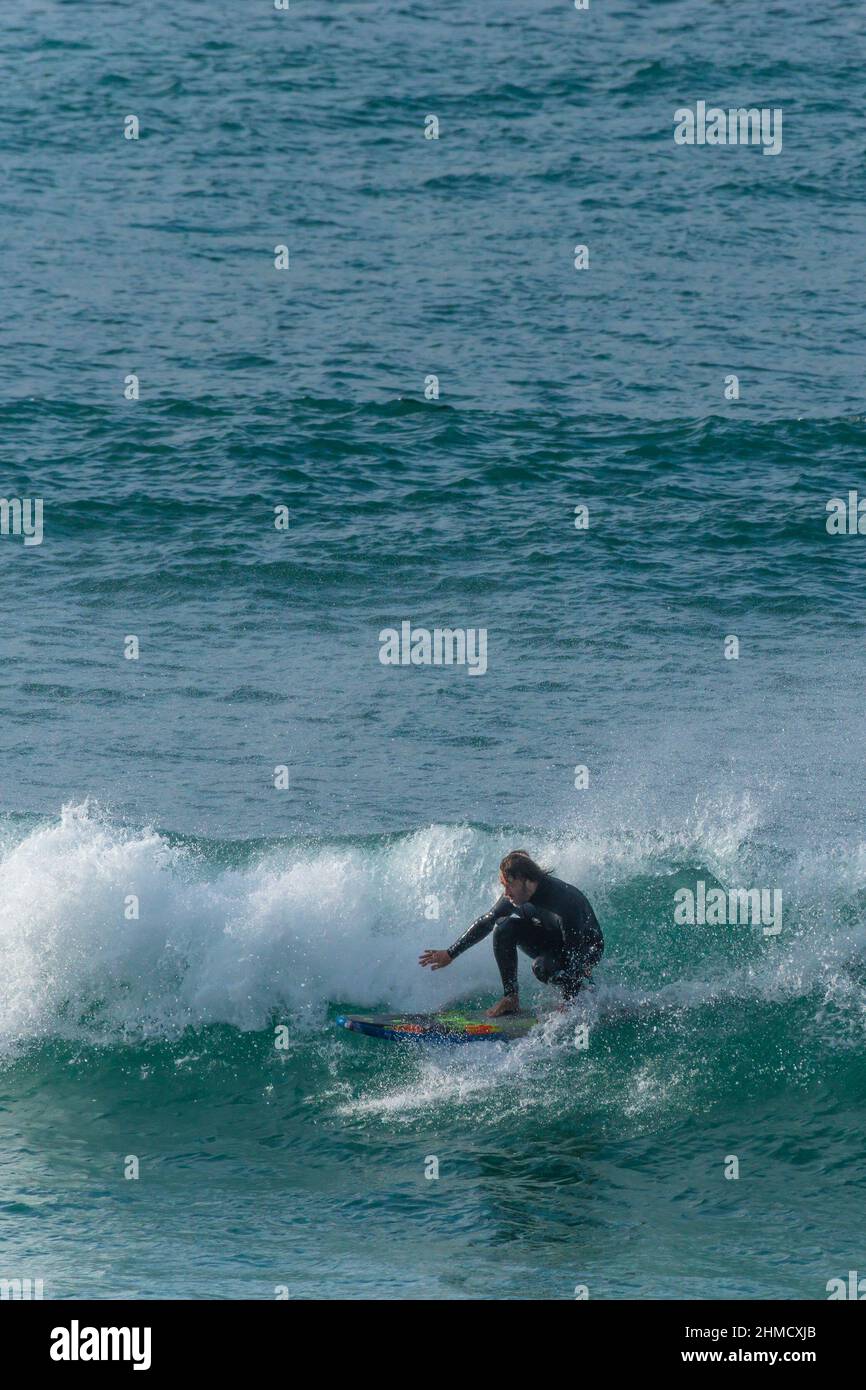 Surfing action at Fistral in Newquay in Cornwall Stock Photo - Alamy