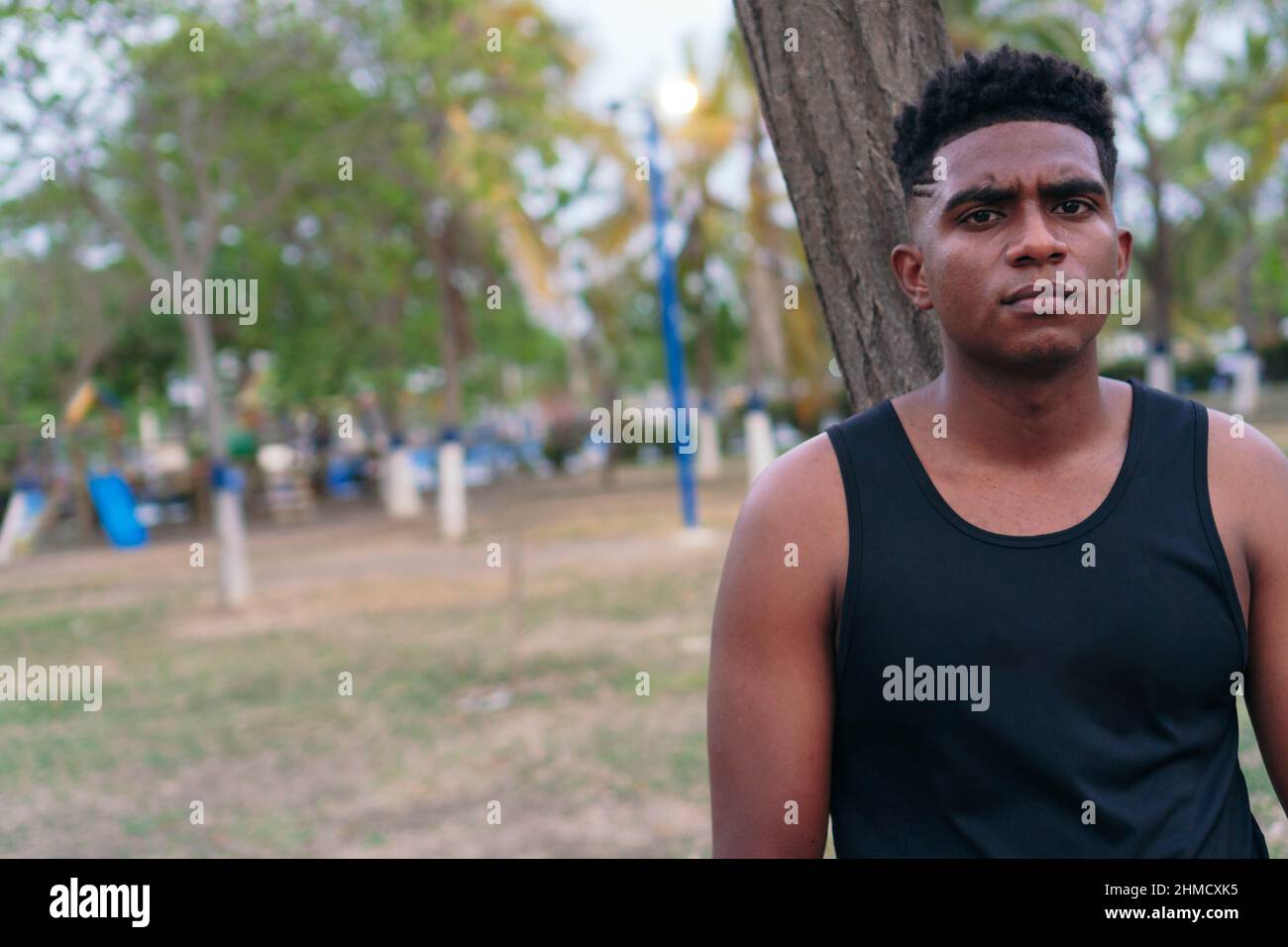 African man leaning against tree hi-res stock photography and images ...