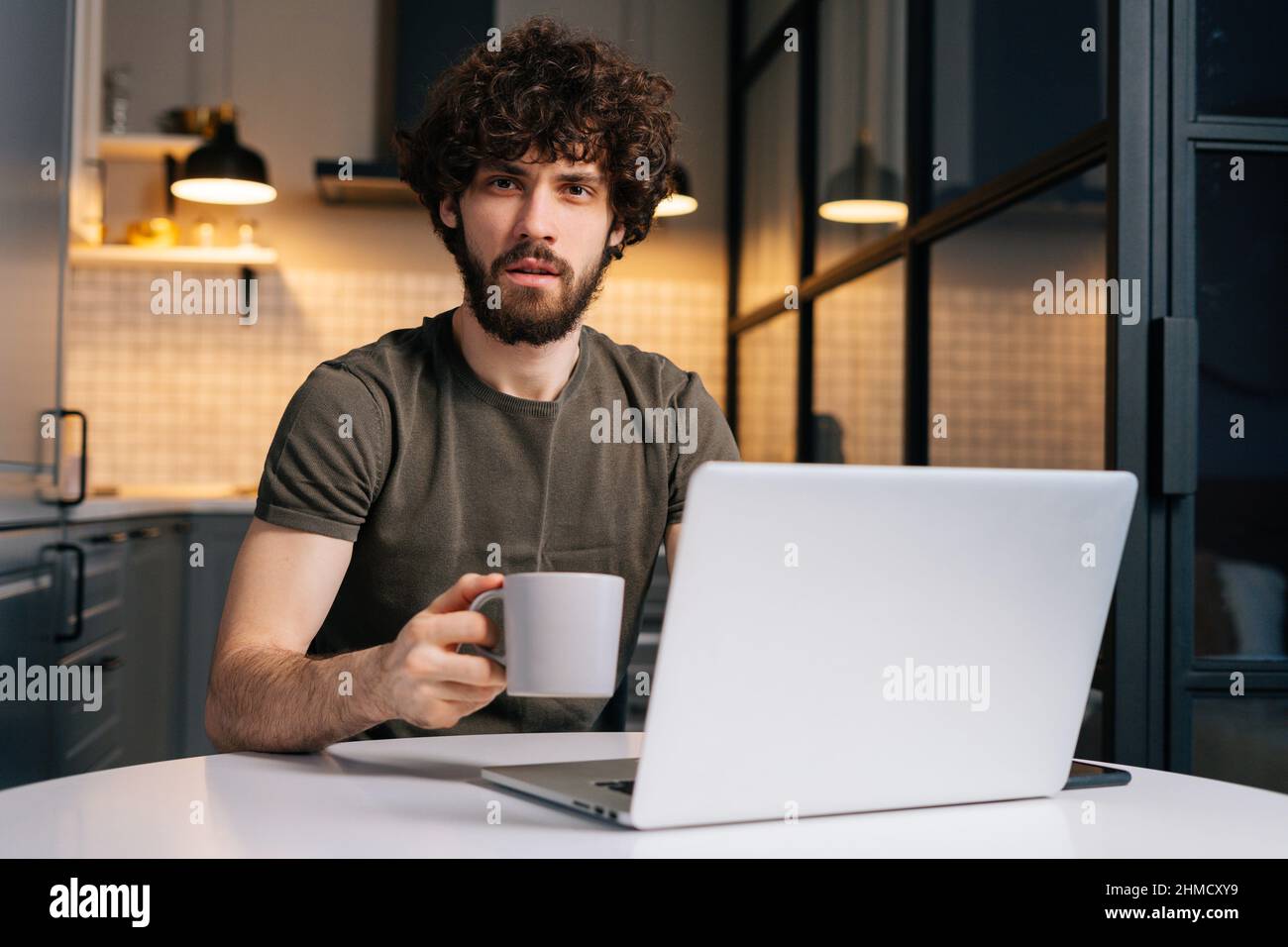 Sad man holding cup coffee hi-res stock photography and images - Alamy