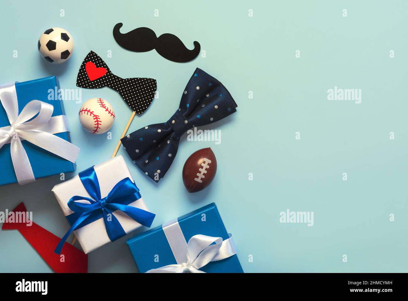 Happy Father's Day. Top view of gifts boxes ,false bow tie and sports ...