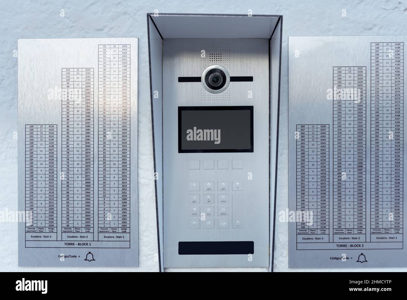 Silver and modern intercom with camera of two skyscrapers and codes by ...