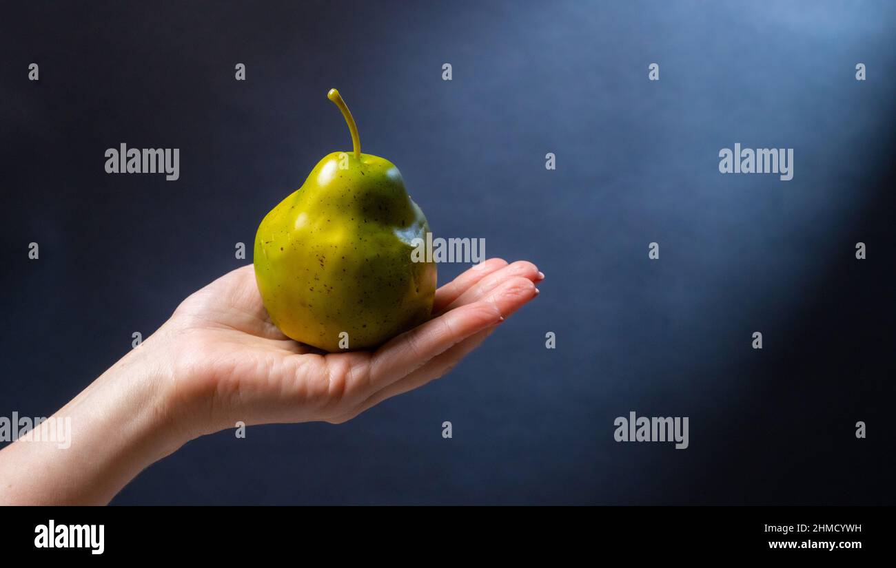 Hand holding pear hi-res stock photography and images - Alamy