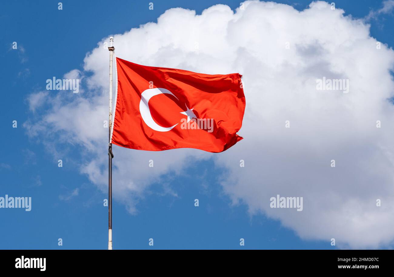 Turkish flag waving on sky background Stock Photo - Alamy