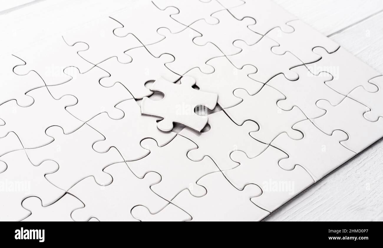 White jigsaw puzzle Stock Photo - Alamy