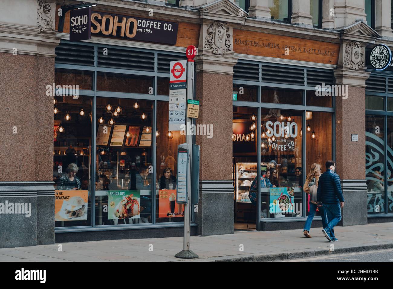 London, UK - October 23, 2021: People walking past Soho Coffee Co ...