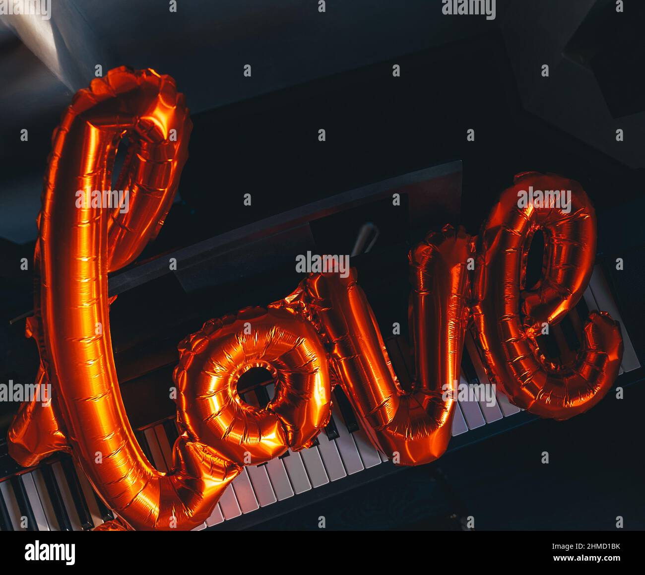balloon in shape of word love on piano keys. copy space. Greeting card ...