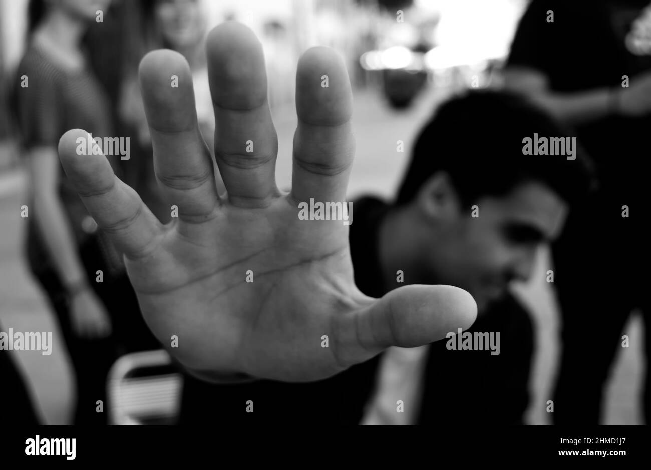 Serious hand signal Black and White Stock Photos & Images - Alamy