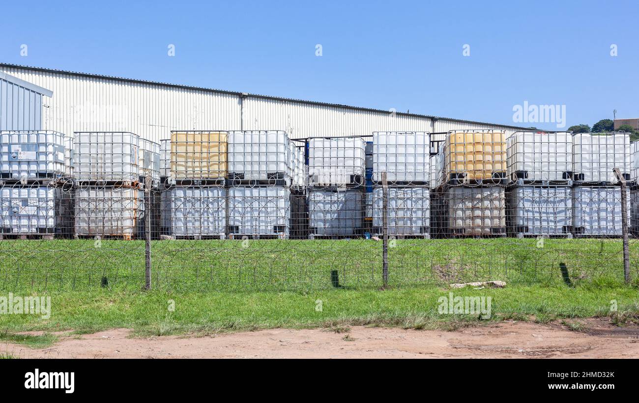 Industrial chemical metal caged holding plastic tanks for liquids ...