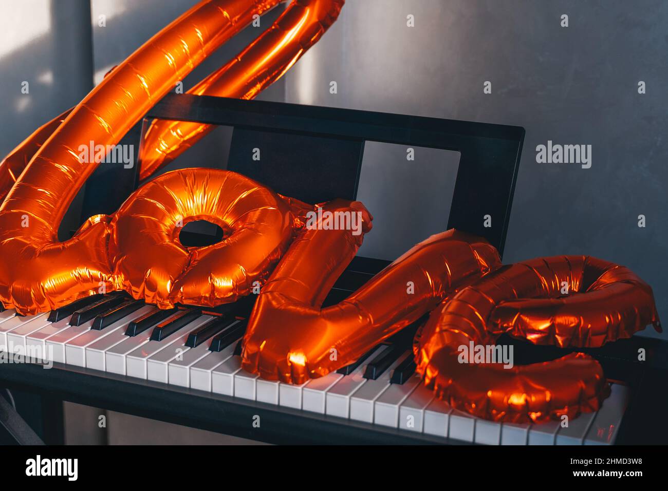 balloon in shape of word love on piano keys. copy space. Greeting card ...